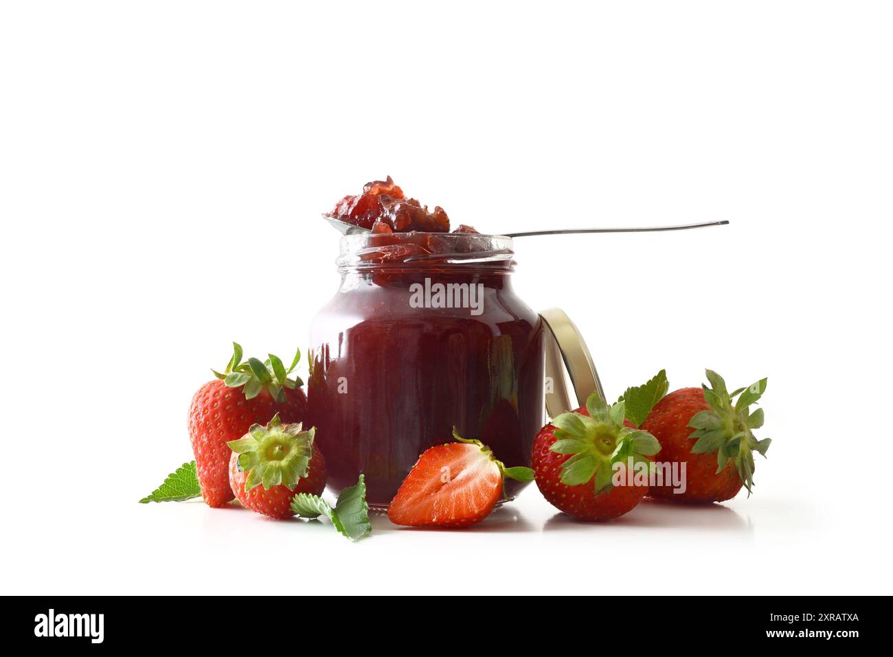 Jar of strawberry jam isolated on white background with fruit around it ...