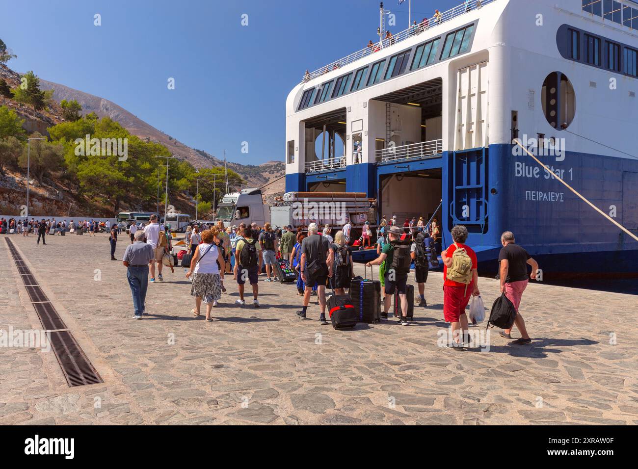 Symi, Greece - September 18, 2023: A queue of tourists for the large ...