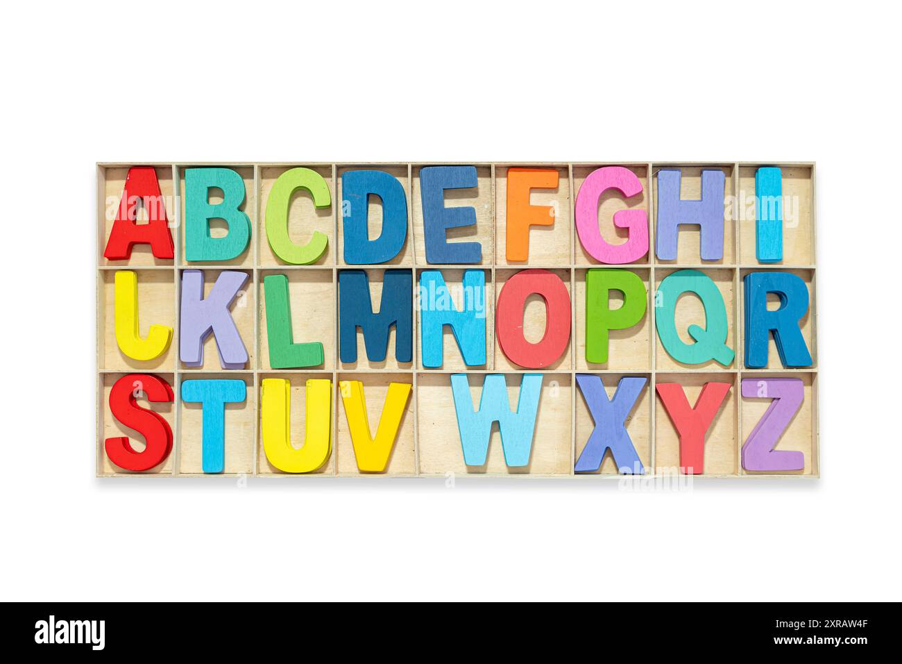 Colorful alphabet, wooden uppercase letters placed in a box, white ...