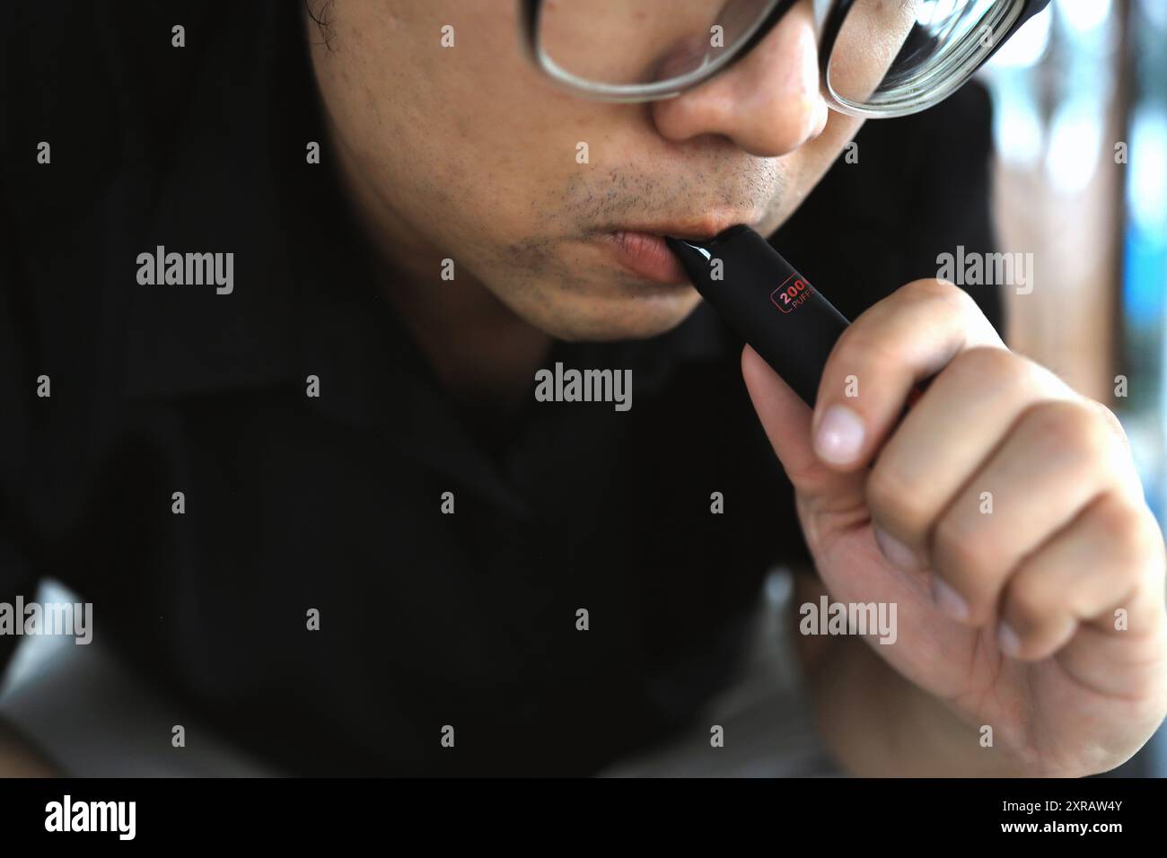 Man Vaping with Electronic Cigarette. The dangers of e-cigarettes Stock ...