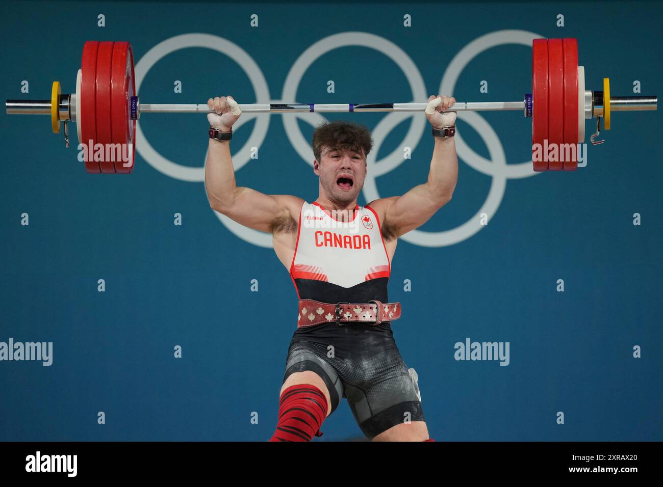 Boady Santavy of Canada competes during the men's 89kg weightlifting ...