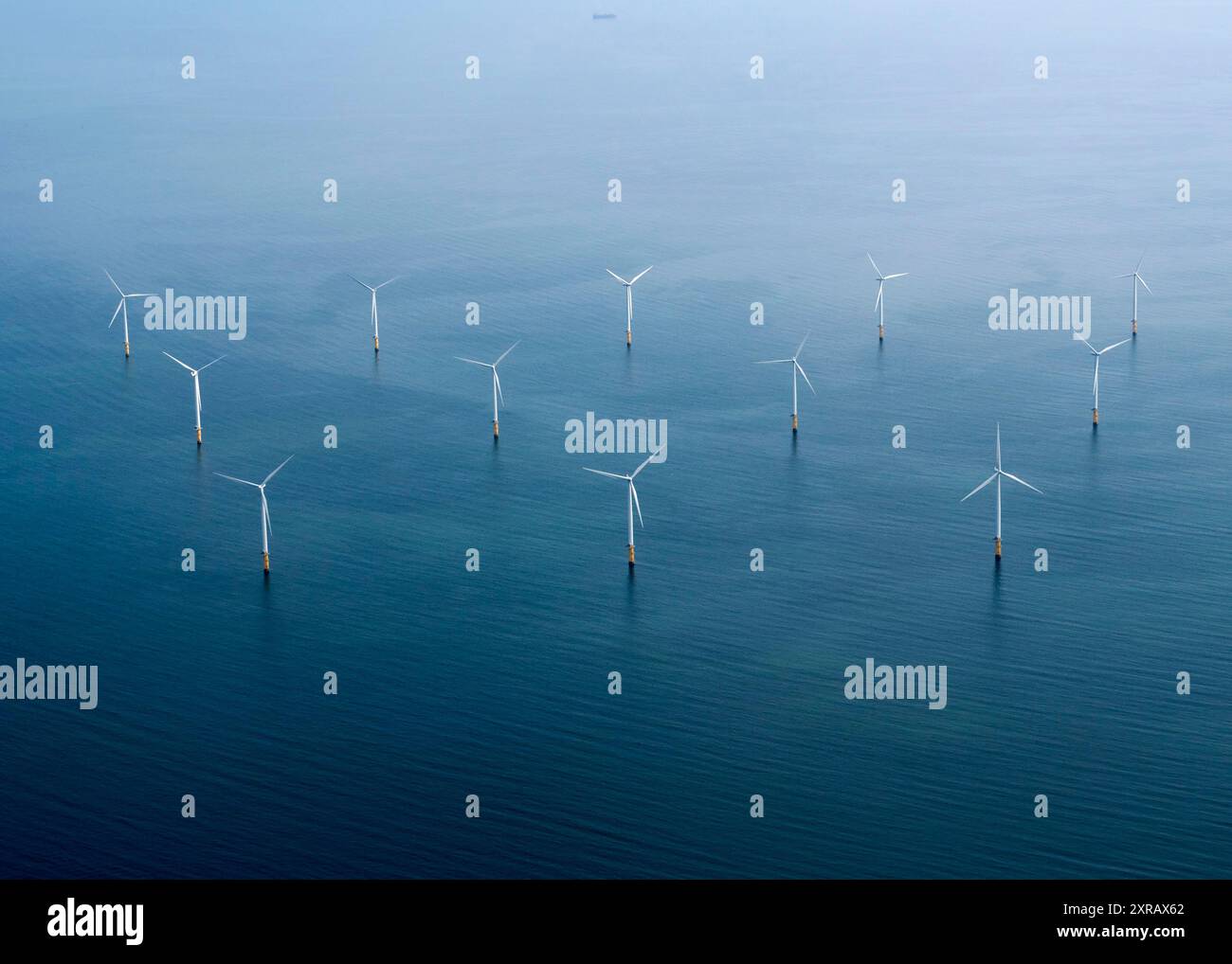 An Aerial drone shot of offshore wind turbines off the mouth of the ...