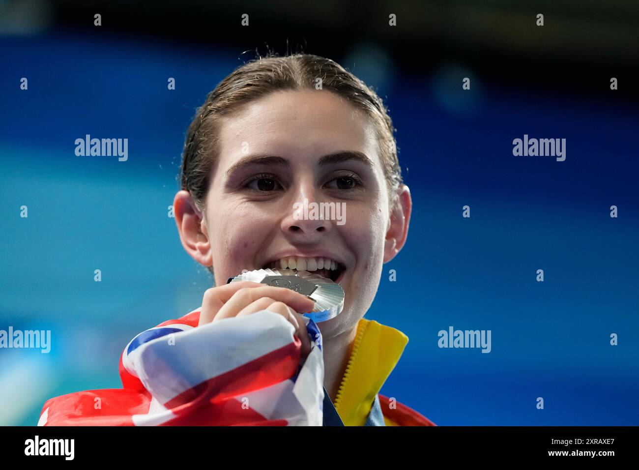 Silver medalist Australia's Maddison Keeney bites her medal after the ...