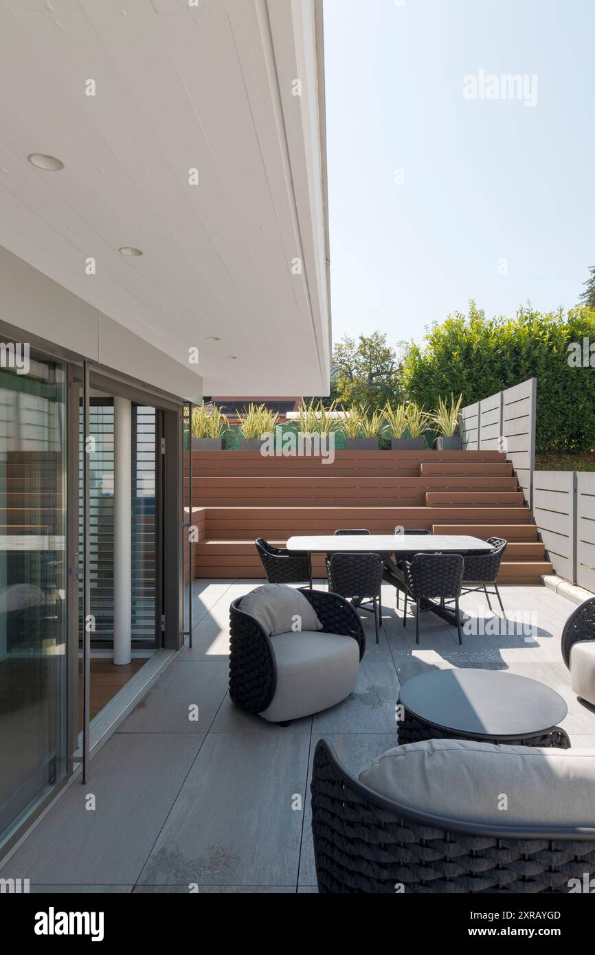 External balcony of villa modena with a small living room composed of a ...