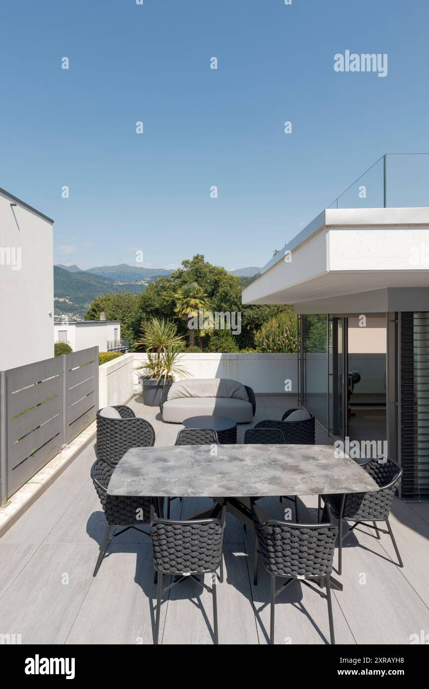 External balcony of villa modena with a small living room composed of a ...
