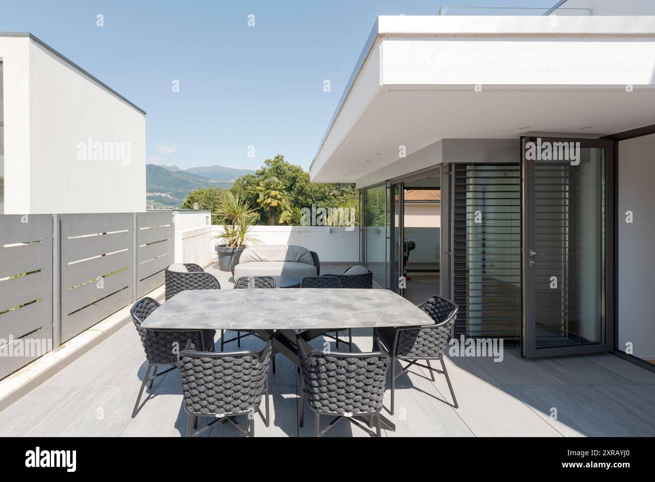 External balcony of villa modena with a small living room composed of a ...