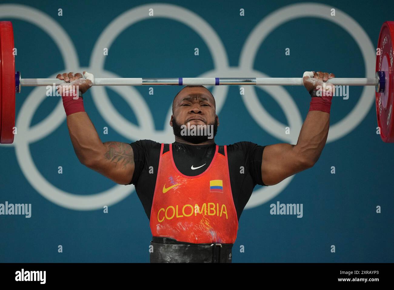 Yeison Lopes of Colombia competes during the men's 89kg weightlifting ...