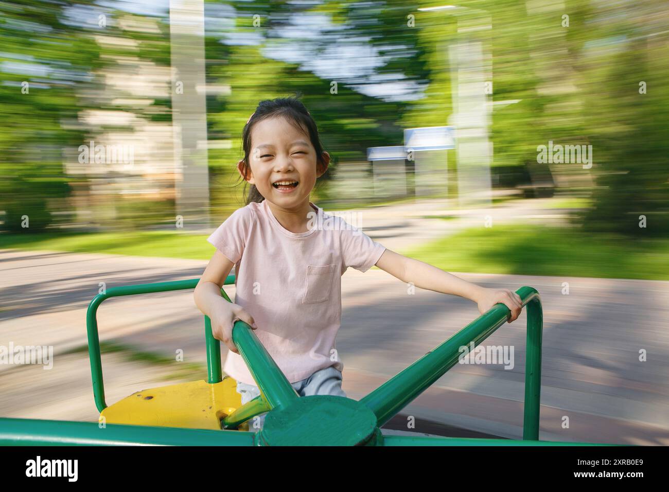 Girl riding on merry go round hi-res stock photography and images - Alamy