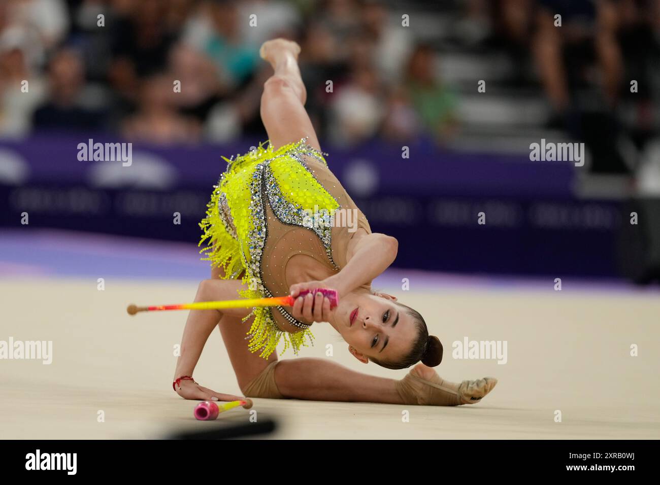 Atamanov Daria, of Israel, performs clubs exercise in the rhythmic ...