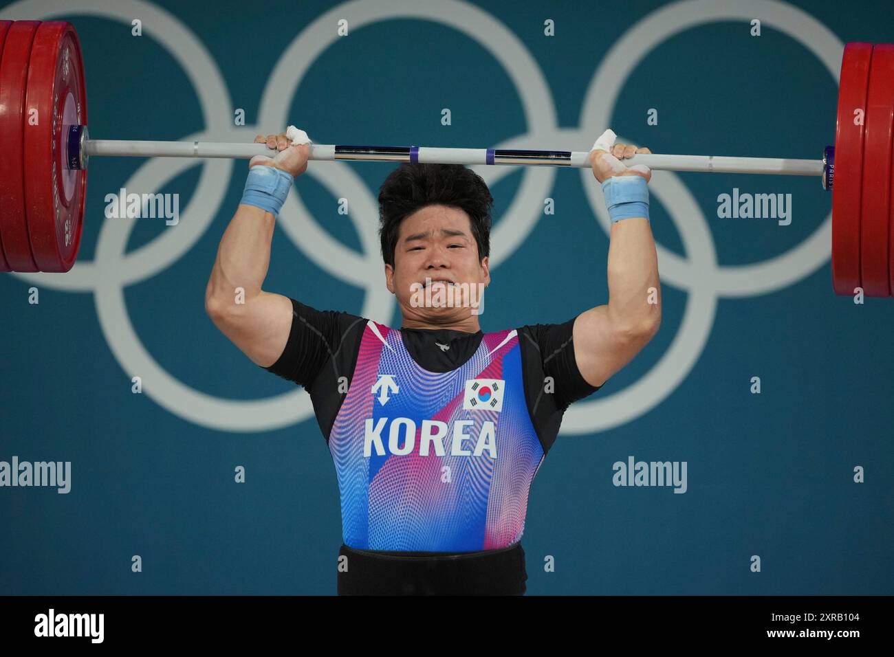 Yu Dong-ju of South Korea competes during the men's 89kg weightlifting ...