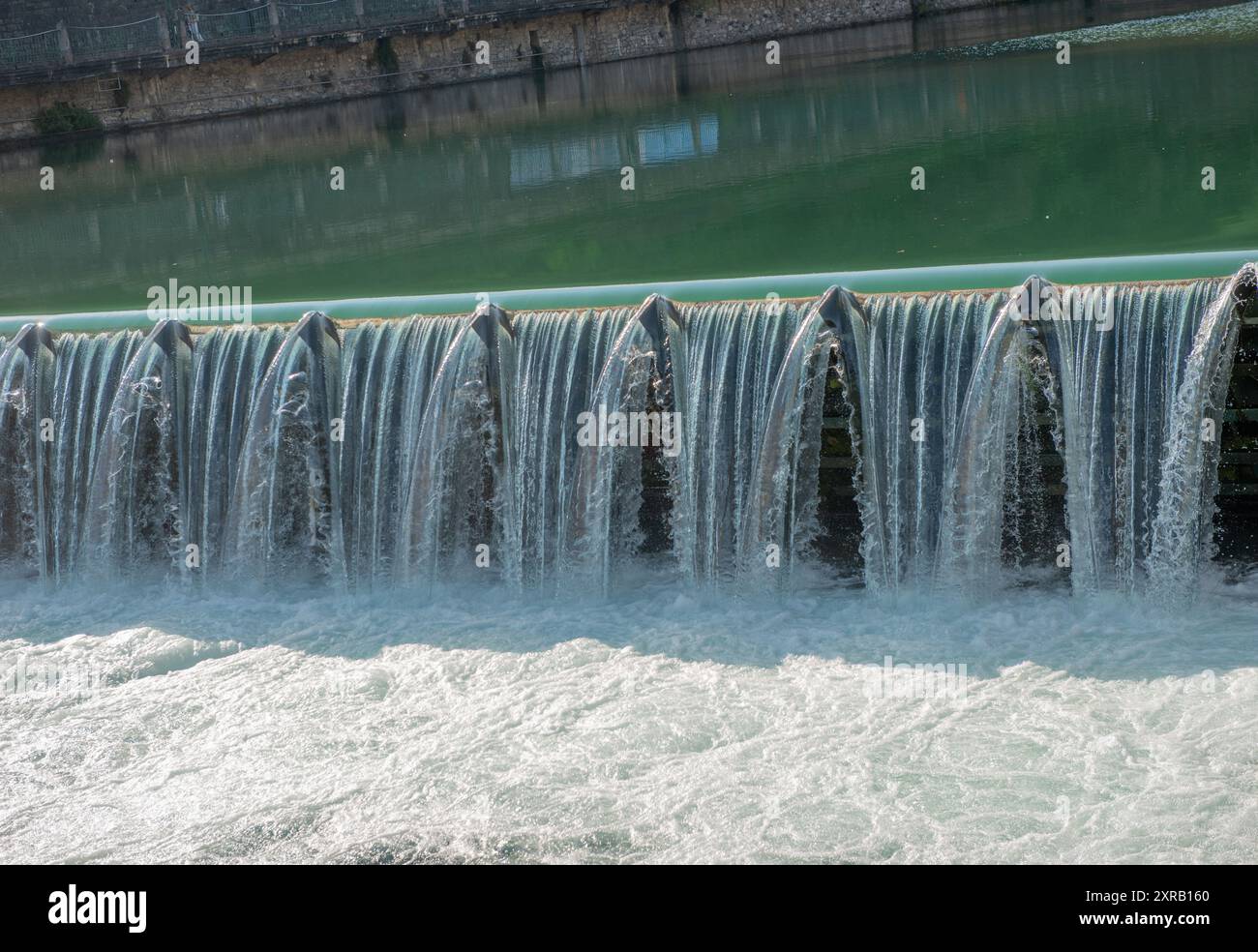 Dam with sluice gates for regulating the flow of the river Stock Photo ...