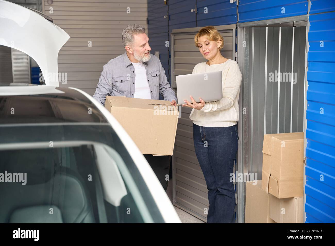 Female and man in self storage unit Stock Photo - Alamy