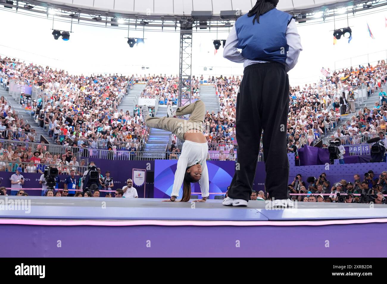 United States Logan Edra, known as B-Girl Logistx, left, competes ...