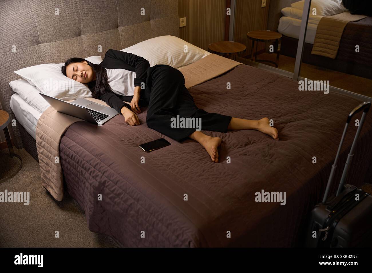 Woman falling asleep on bed hi-res stock photography and images - Alamy