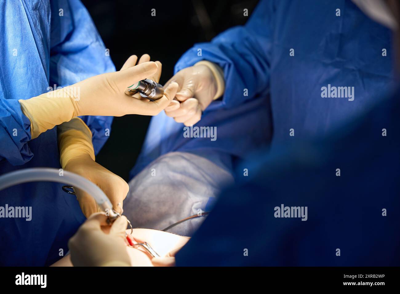 Medical team performs a surgical operation in a modern operating room ...