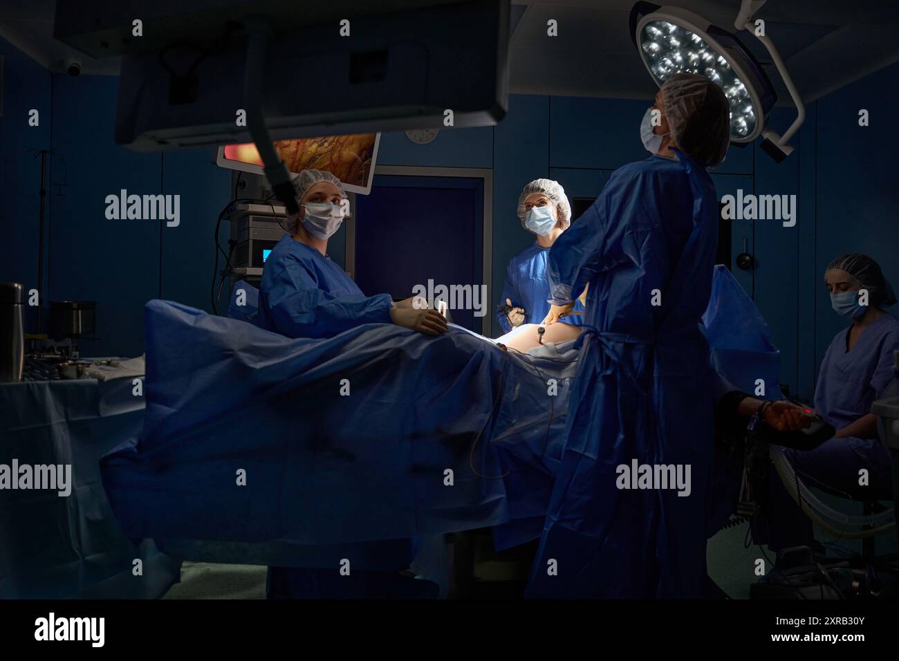 Doctor and assistants in the operating room for surgical hospital Stock ...