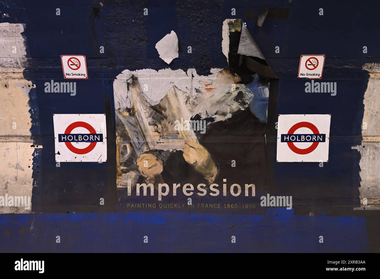 An old ripped poster advertising French Impressionism on a disused ...