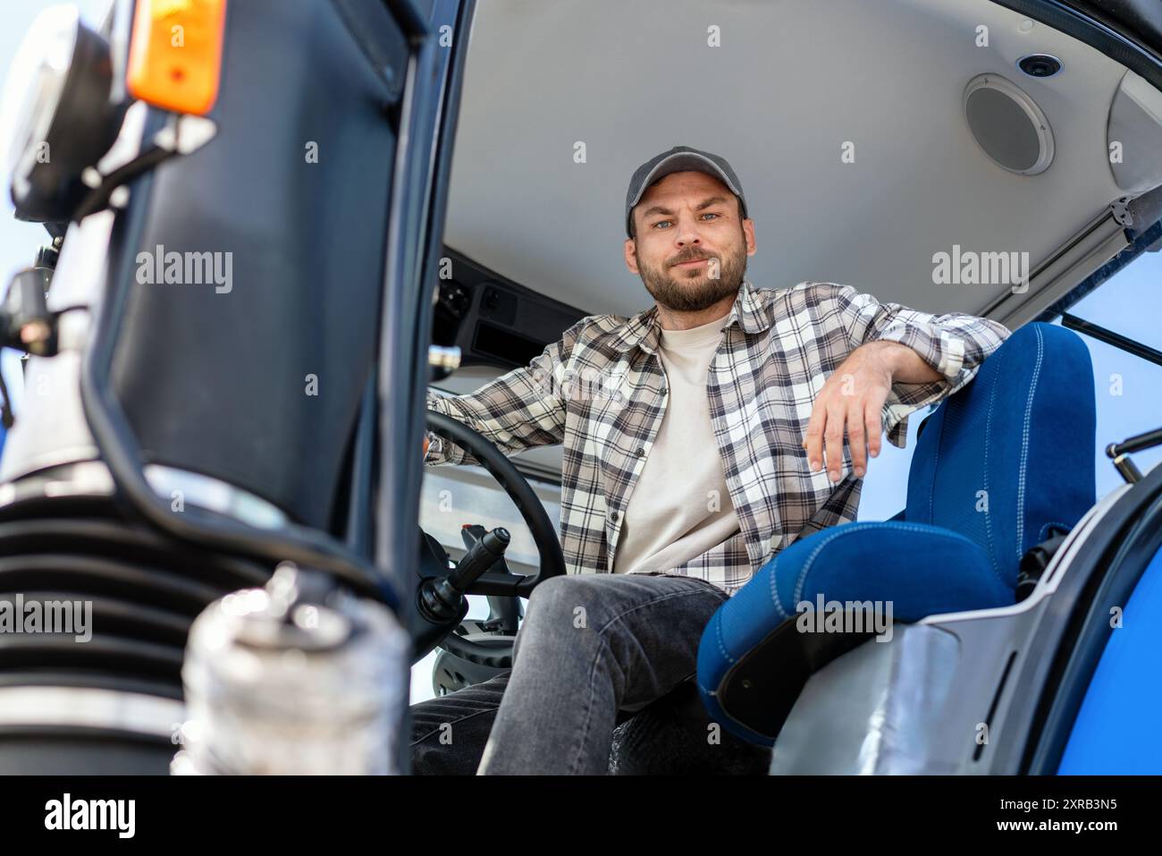 Tractor sits hi-res stock photography and images - Alamy