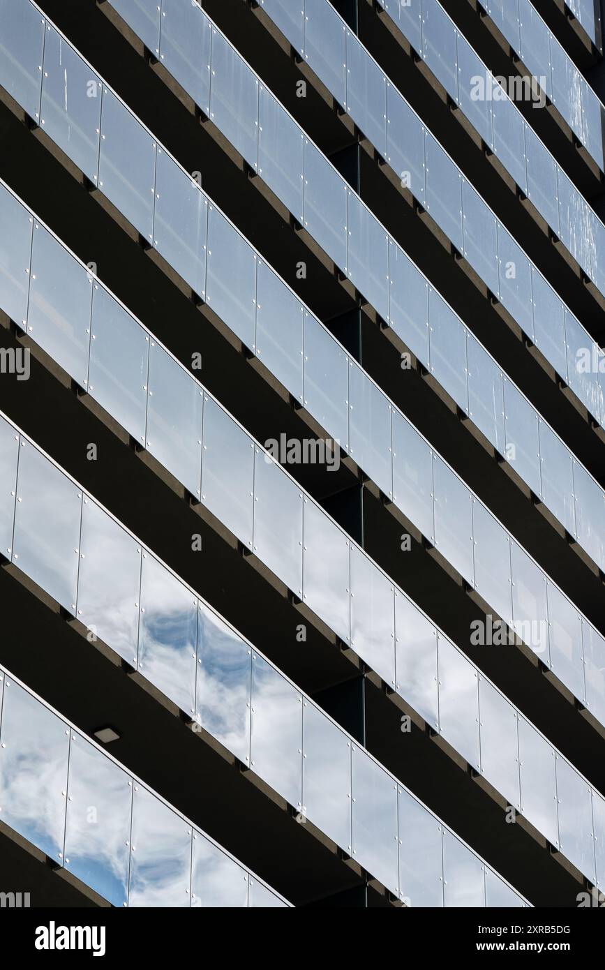 Modern residential building facade. Symmetrical balcony strips ...