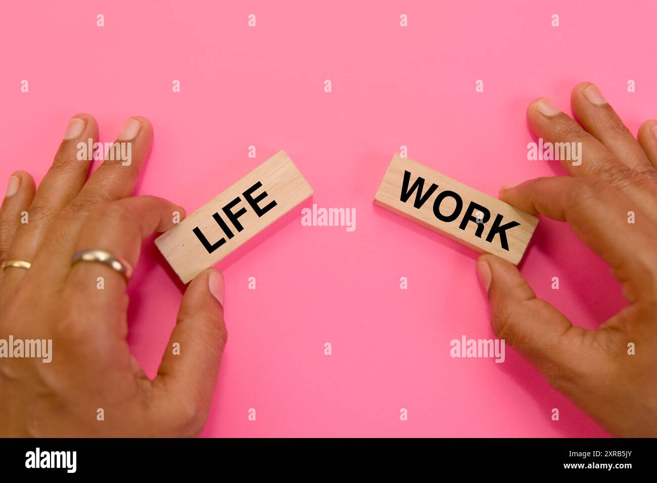 Hands arrange wooden blocks hi-res stock photography and images - Alamy