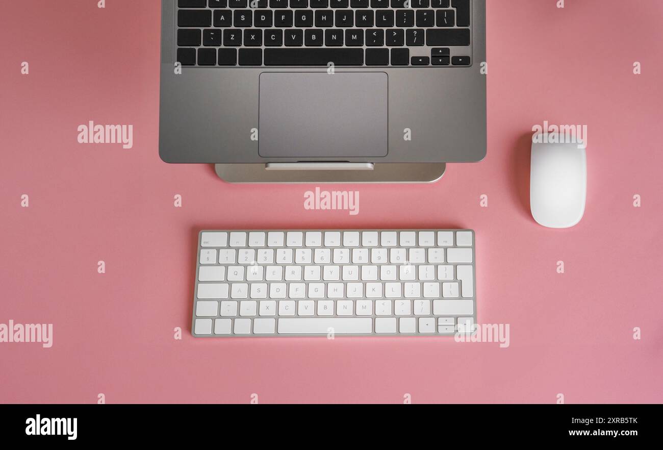 Laptop keyboard from above. Clean empty peach colour background Stock ...