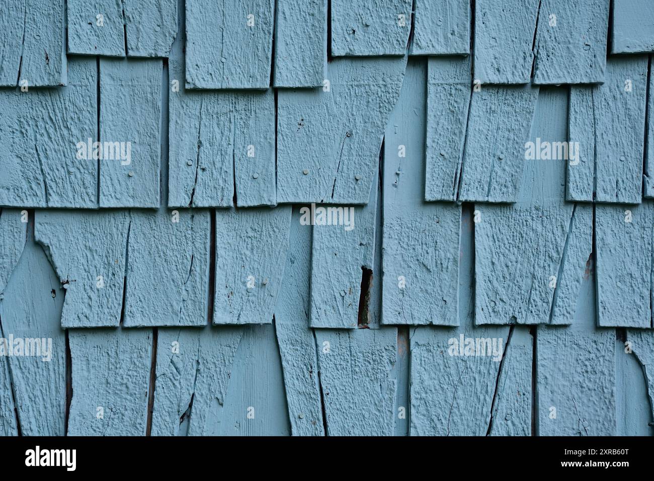 Worn out painted blue cedar shingles. Exterior wall shingle needing ...