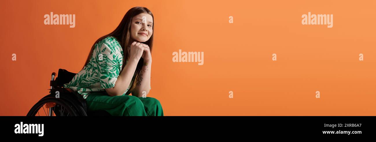 A disabled young woman in a vibrant green dress sitting confidently in ...