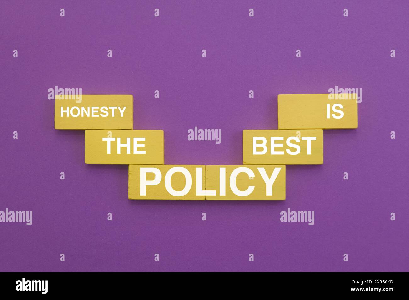 Yellow blocks spell "Honesty is the best policy" against a vibrant ...