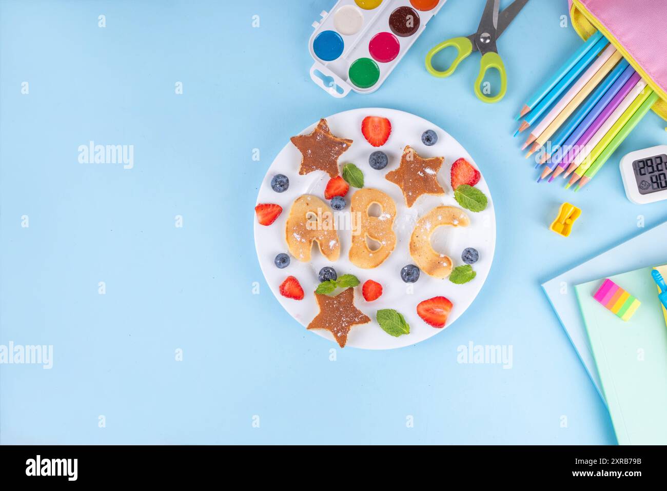 Back to school, school kids breakfast with creative shaped pancakes and ...