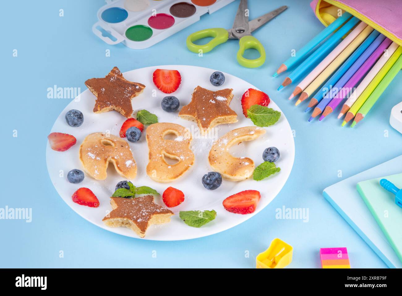 Back to school, school kids breakfast with creative shaped pancakes and ...
