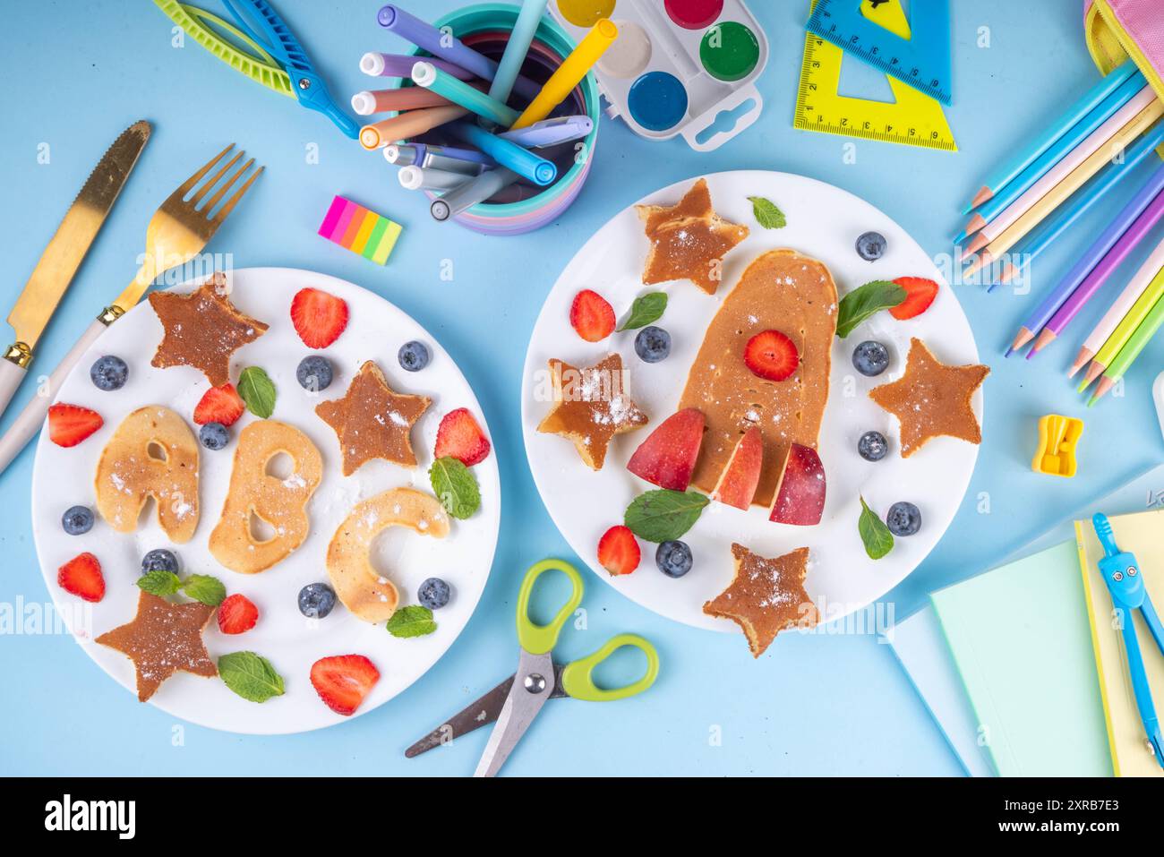 Back to school, school kids breakfast with creative shaped pancakes and ...