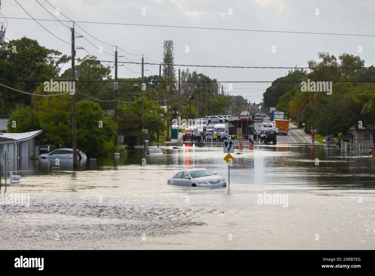 Hurricane Debby flooded city street with trapped car submerged under ...