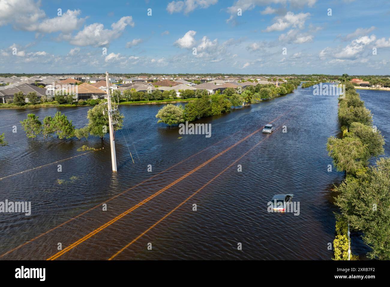 Hurricane Debby flooded city street with trapped car submerged under ...