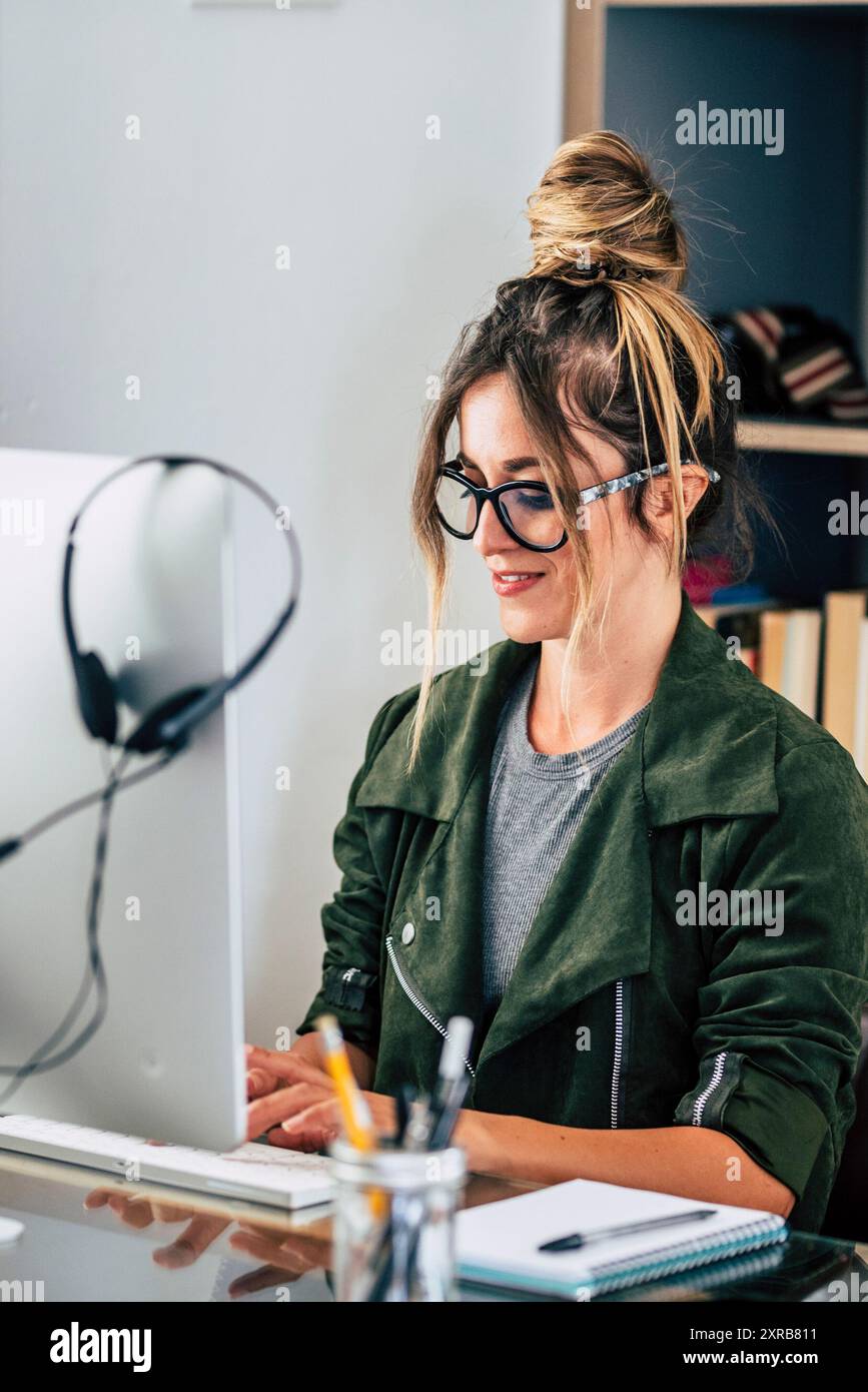 Young businesswoman write on laptop computer at home in smart working ...