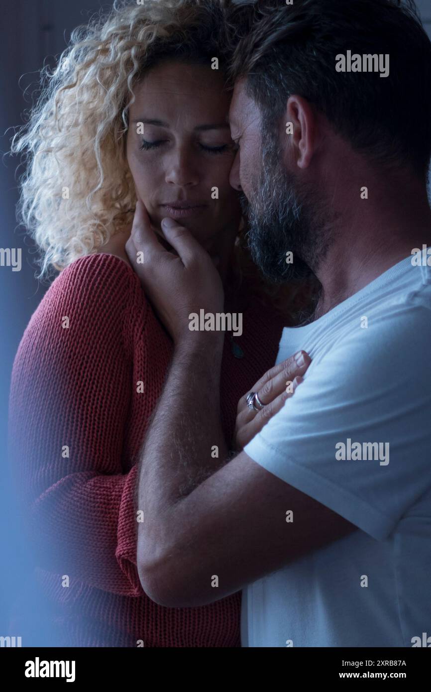 Couple and passion at home with young adult man and woman kissing and ...