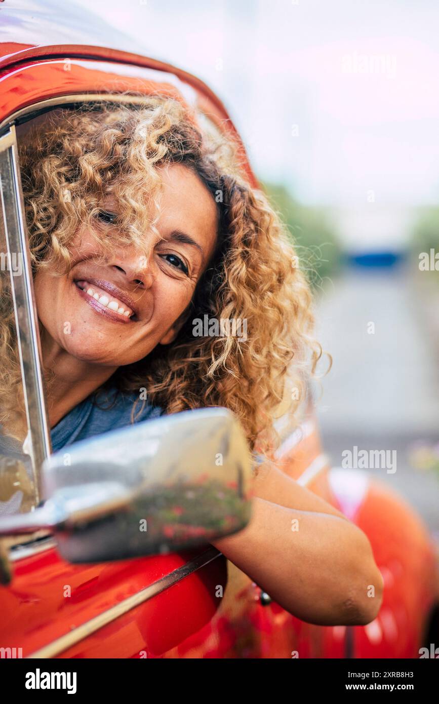 Portrait of cheerful happy adult pretty woman smile and enjoy driving ...