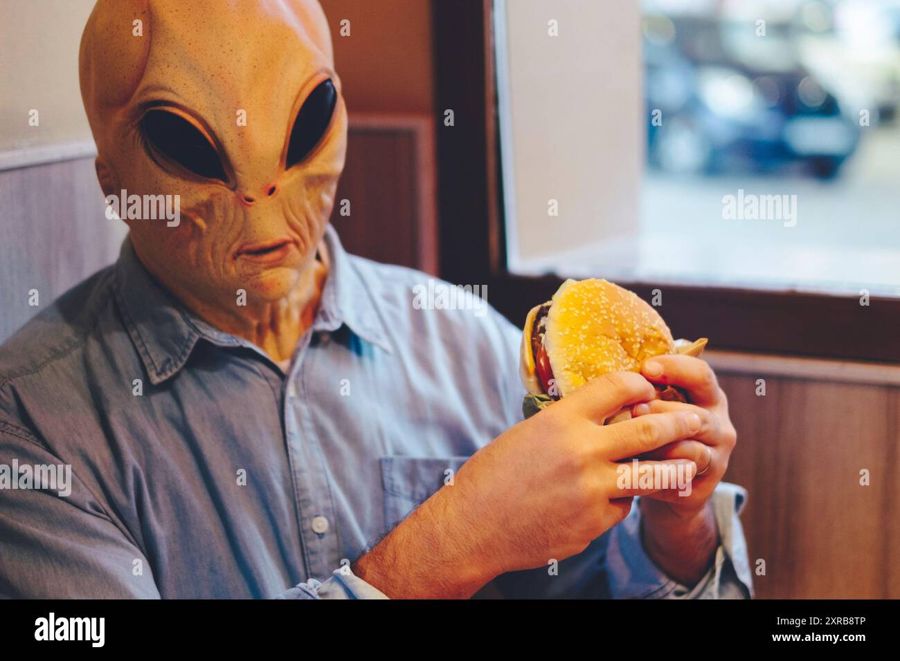 Man eating sandwich sitting table hi-res stock photography and images ...