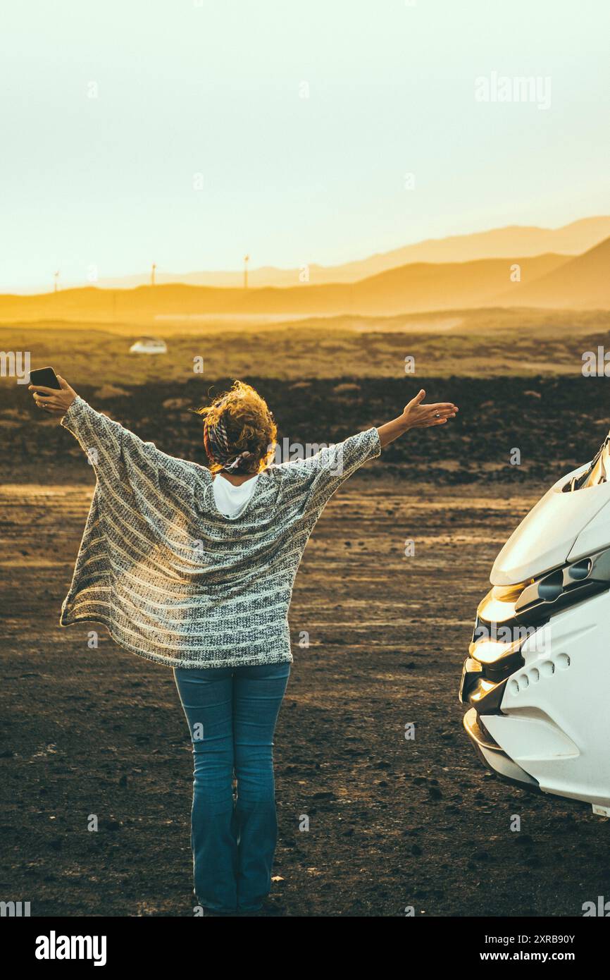 Woman viewed from back enjoy happy her destination in campe van life ...