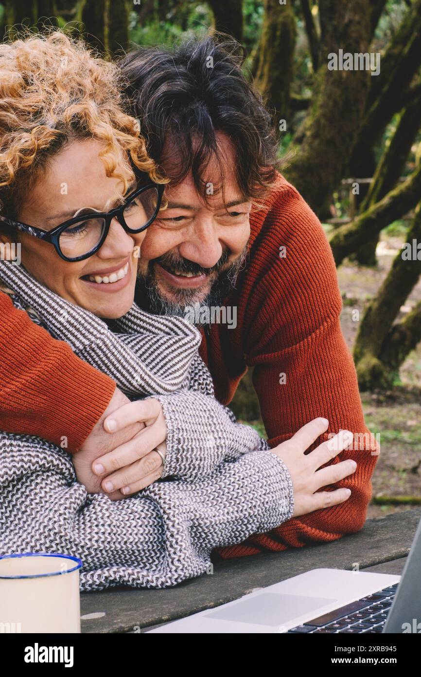 Happy couple in love and friendship enjoy video call on laptop together ...