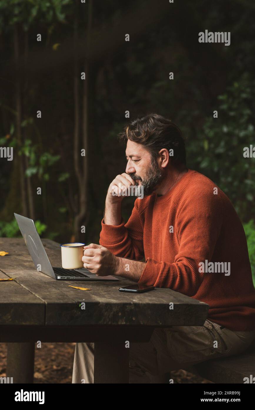 Mature man sit down table hi-res stock photography and images - Alamy