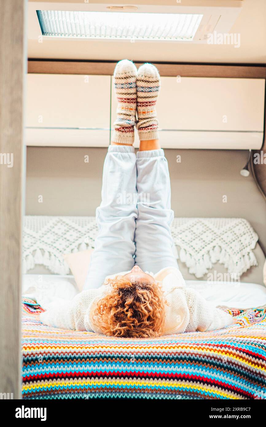 Healthy traveler woman doing stretching and workout exercises inside a ...