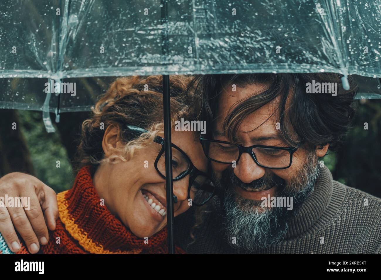 Romantic couple in love under umbrella in rainy day. Man and woman ...