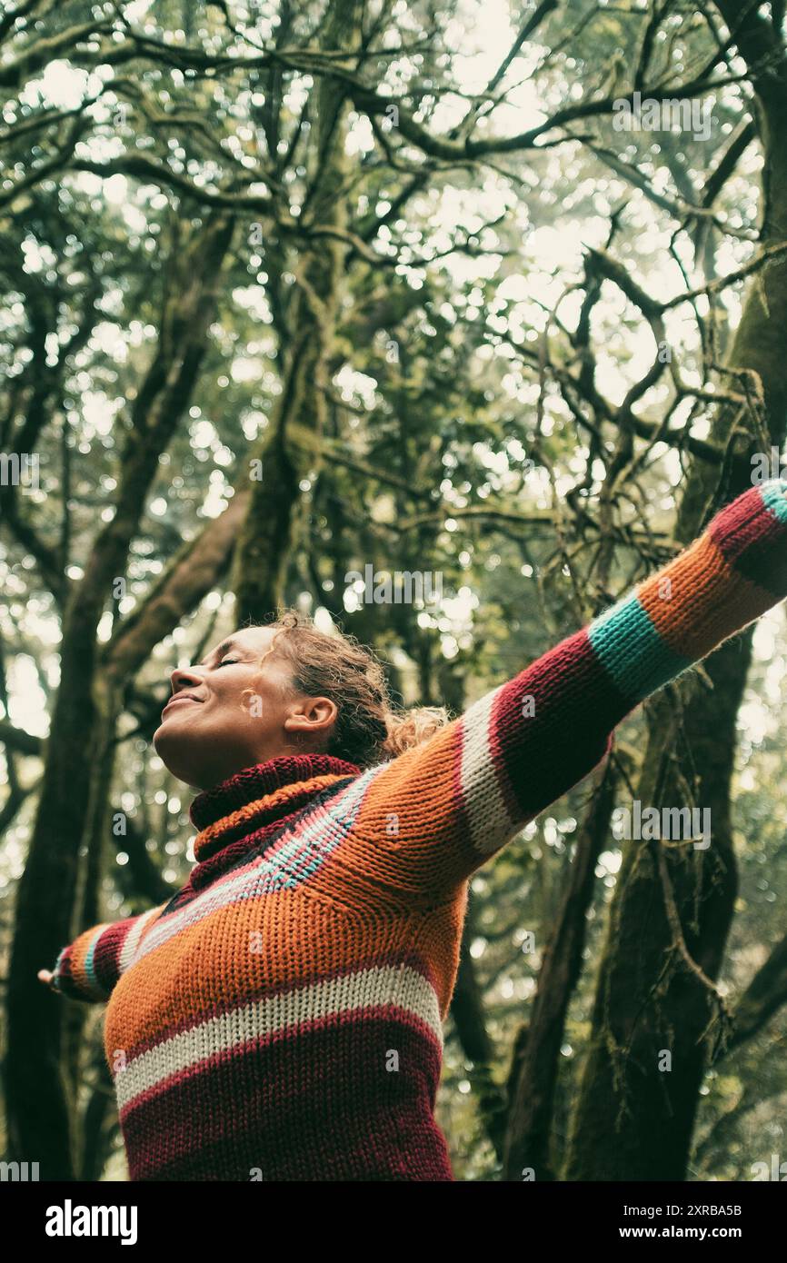 Happy adult woman smile and open arms to embrace beautiful nature ...