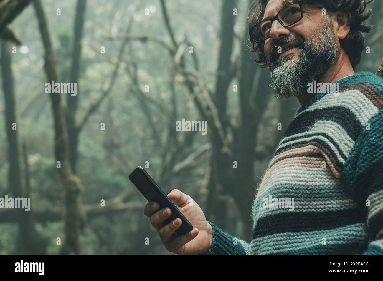 Man standing alone in woods hi-res stock photography and images - Alamy