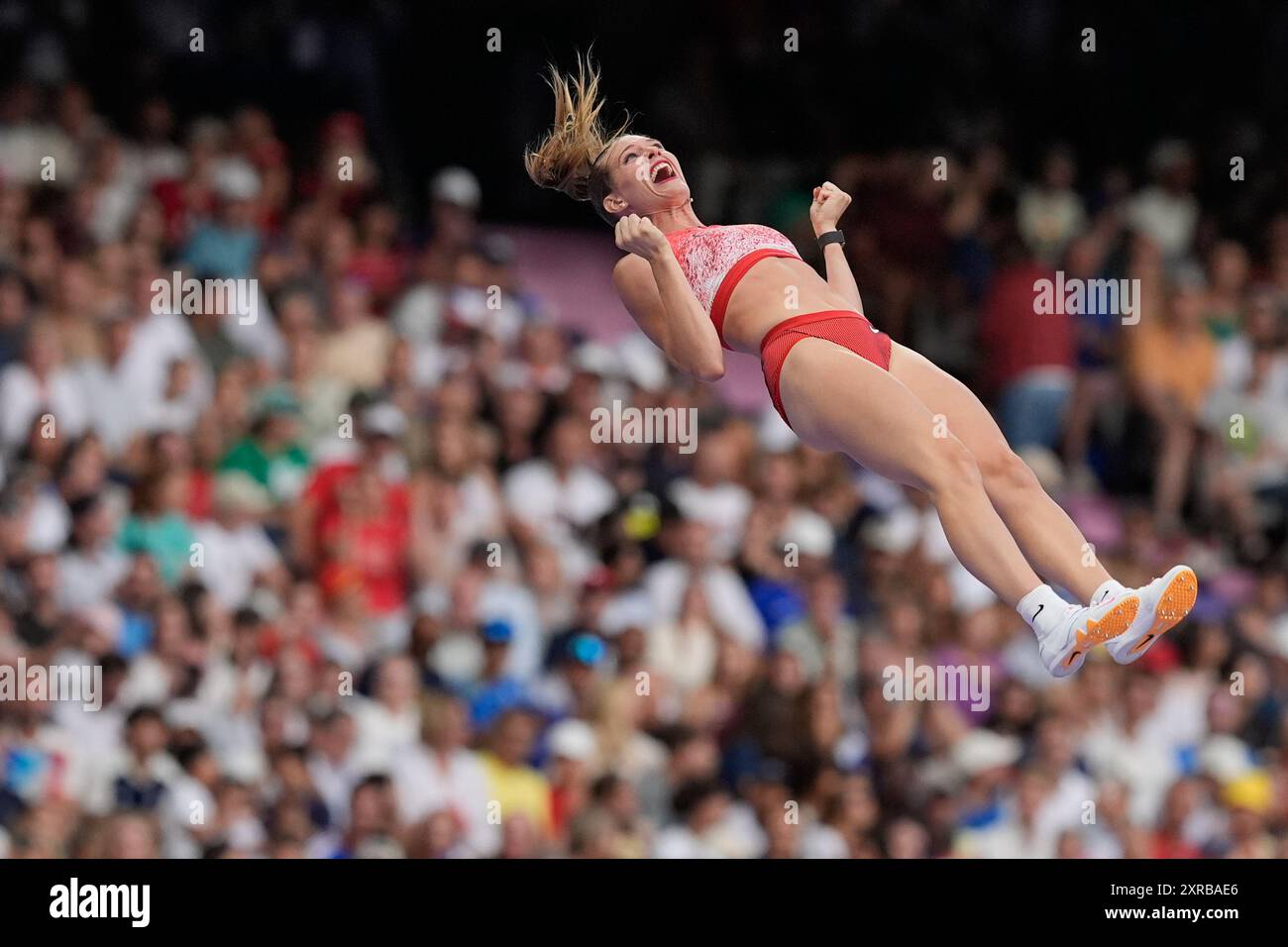 FILE - Alysha Newman, of Canada, celebrates a successful vault as she ...
