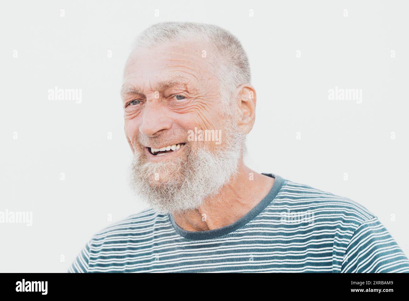 75 year old senior man laughs while having a good time outdoors Stock ...
