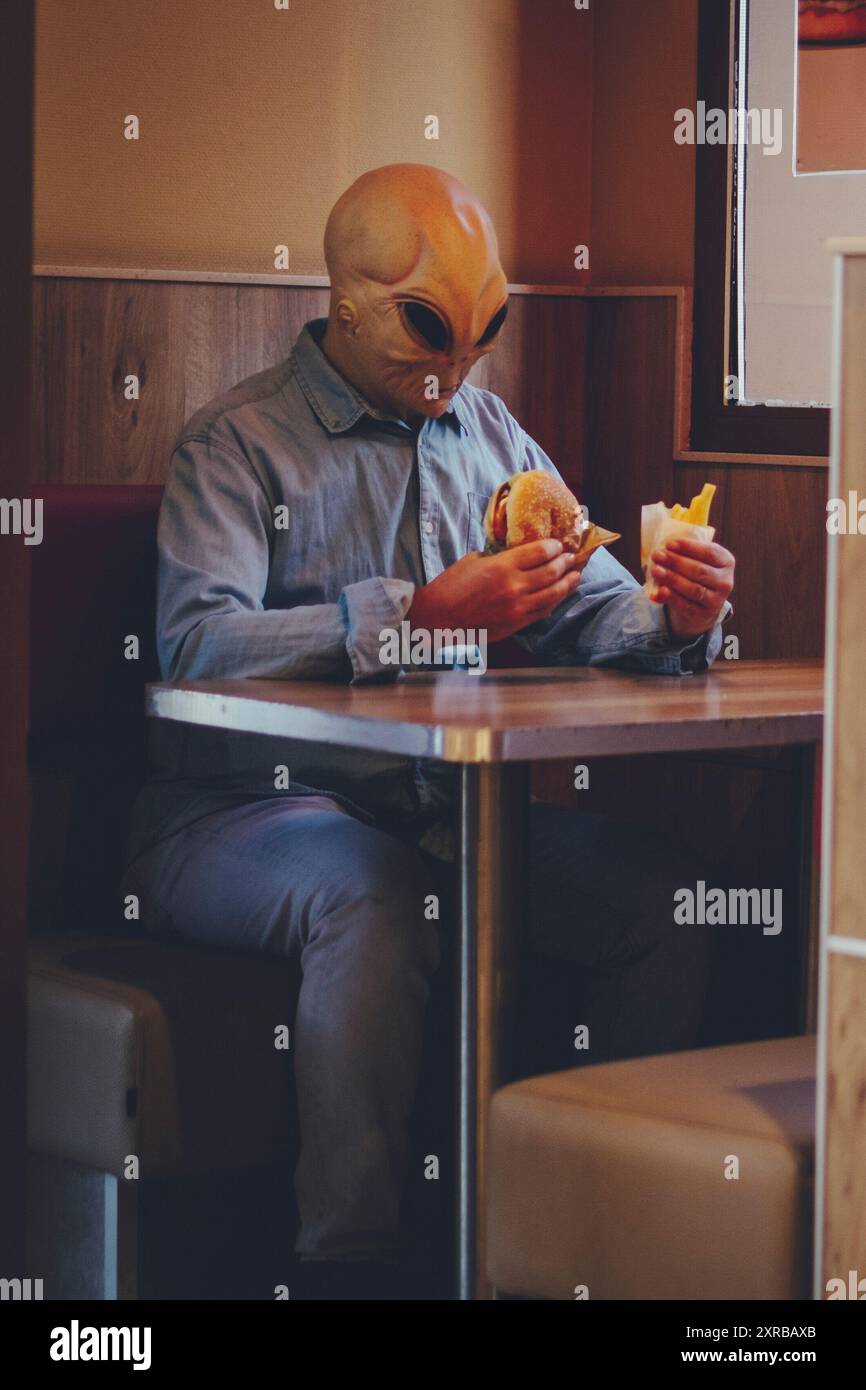 Funny man eating hamburger hi-res stock photography and images - Alamy