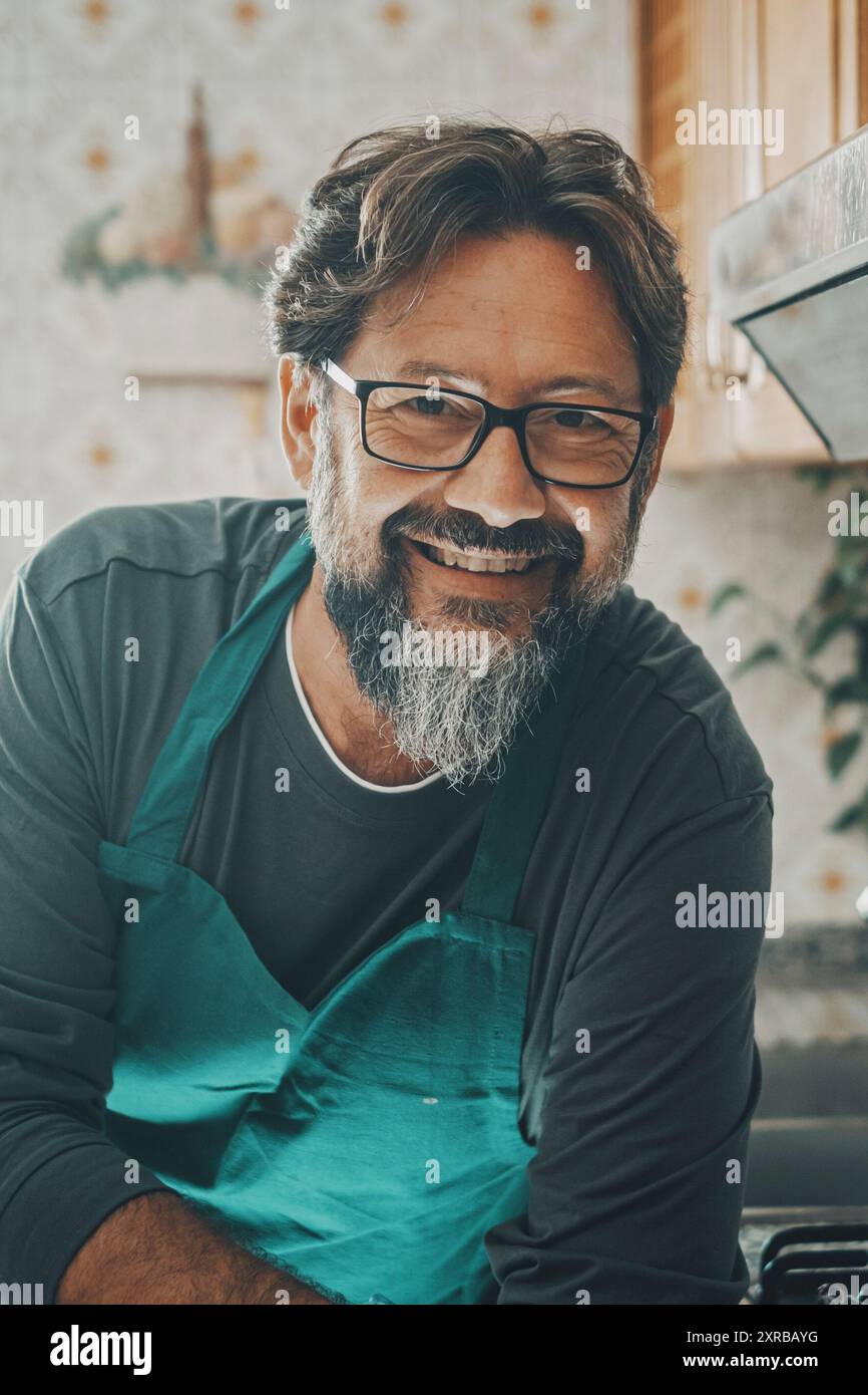 Portrait of man housekeeper looking on camera happy smiling and ...