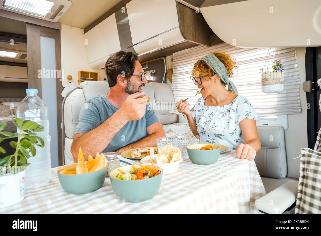 A happy couple spending time together having fun during lunch inside a ...