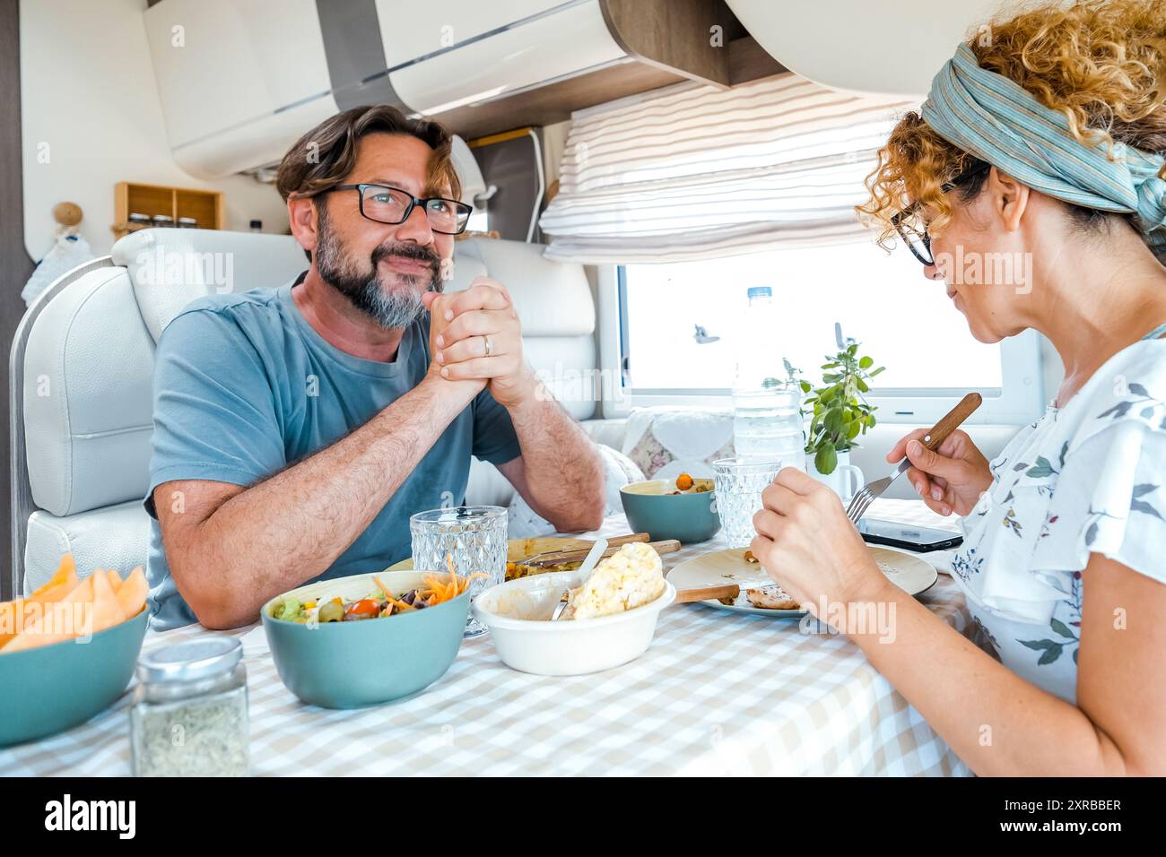 A happy couple spending time together having fun during lunch inside a ...